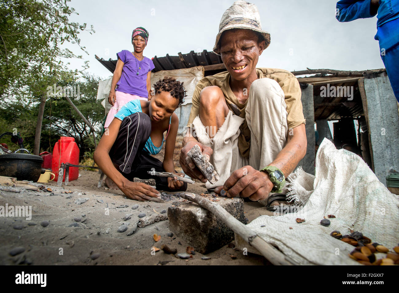 Bushmen or San people preparing food in Botswana, Africa Stock Photo ...