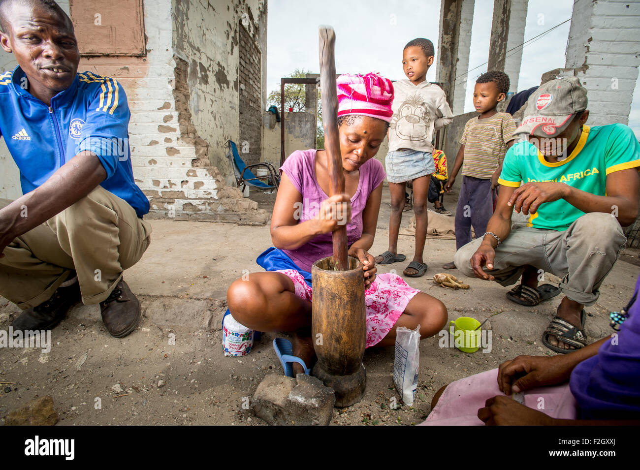 Bushmen or San people preparing food in Botswana, Africa Stock Photo ...