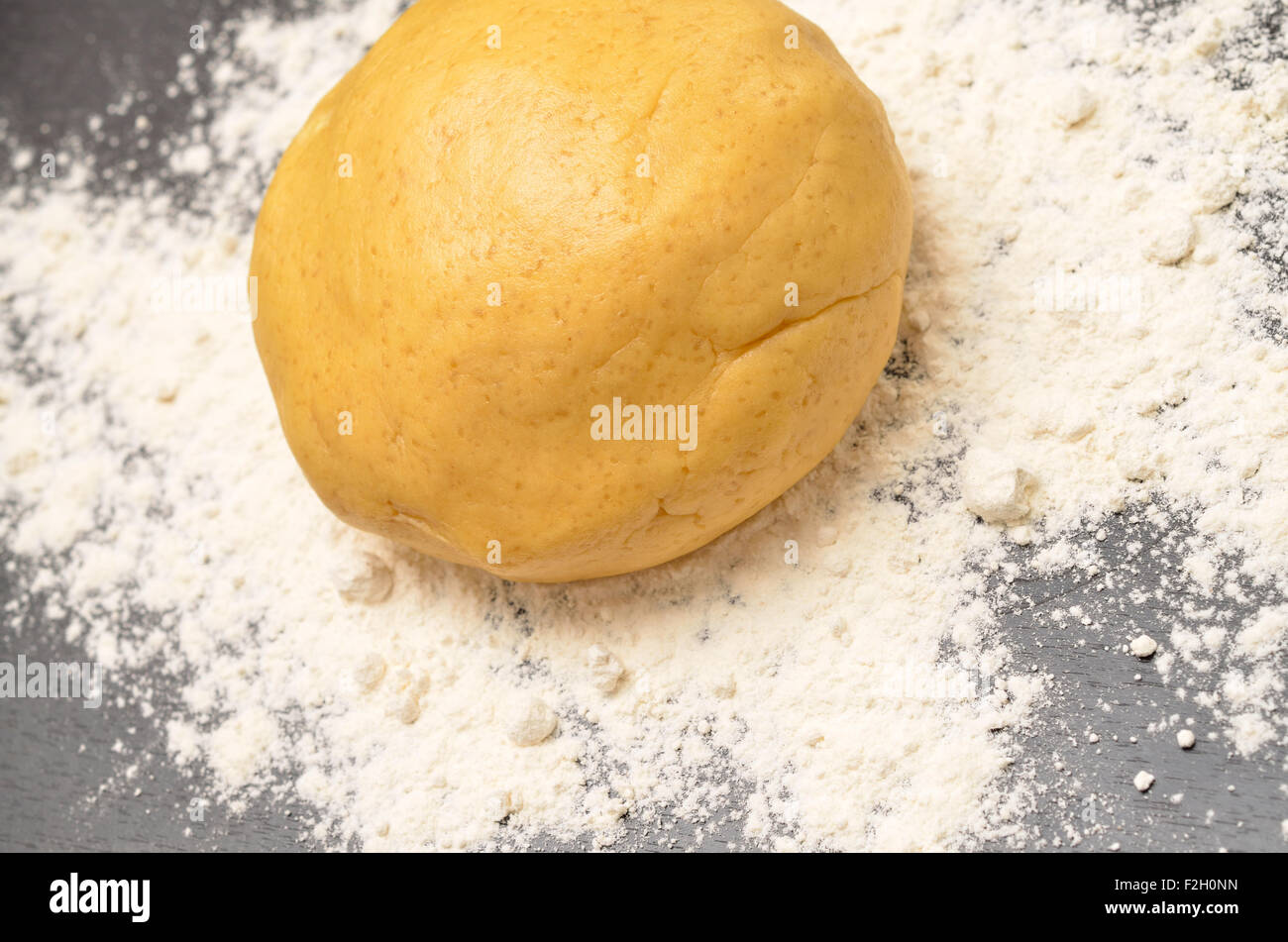Dough ball on flour Stock Photo - Alamy
