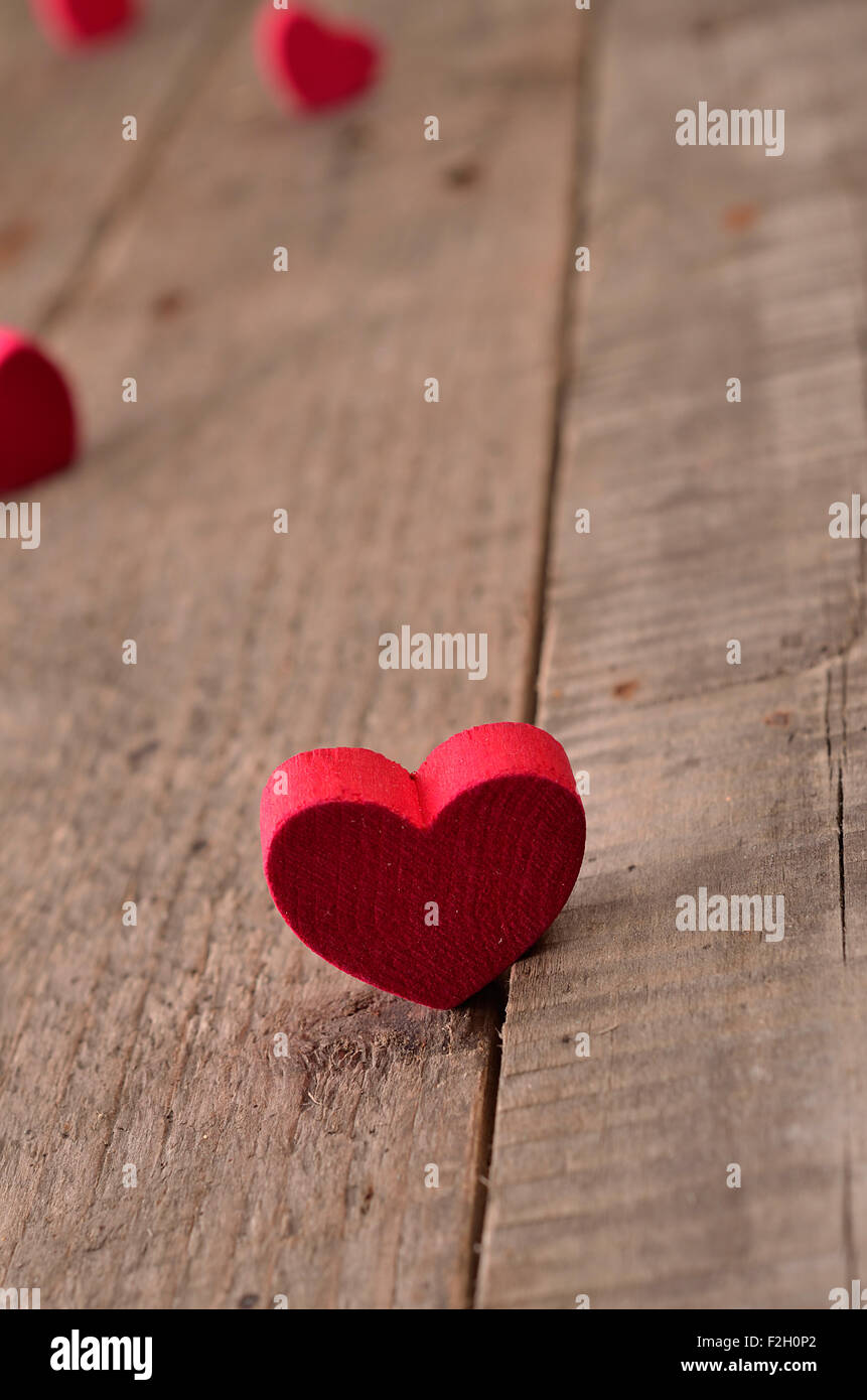 Red heart shape on a rustic wooden background Stock Photo - Alamy