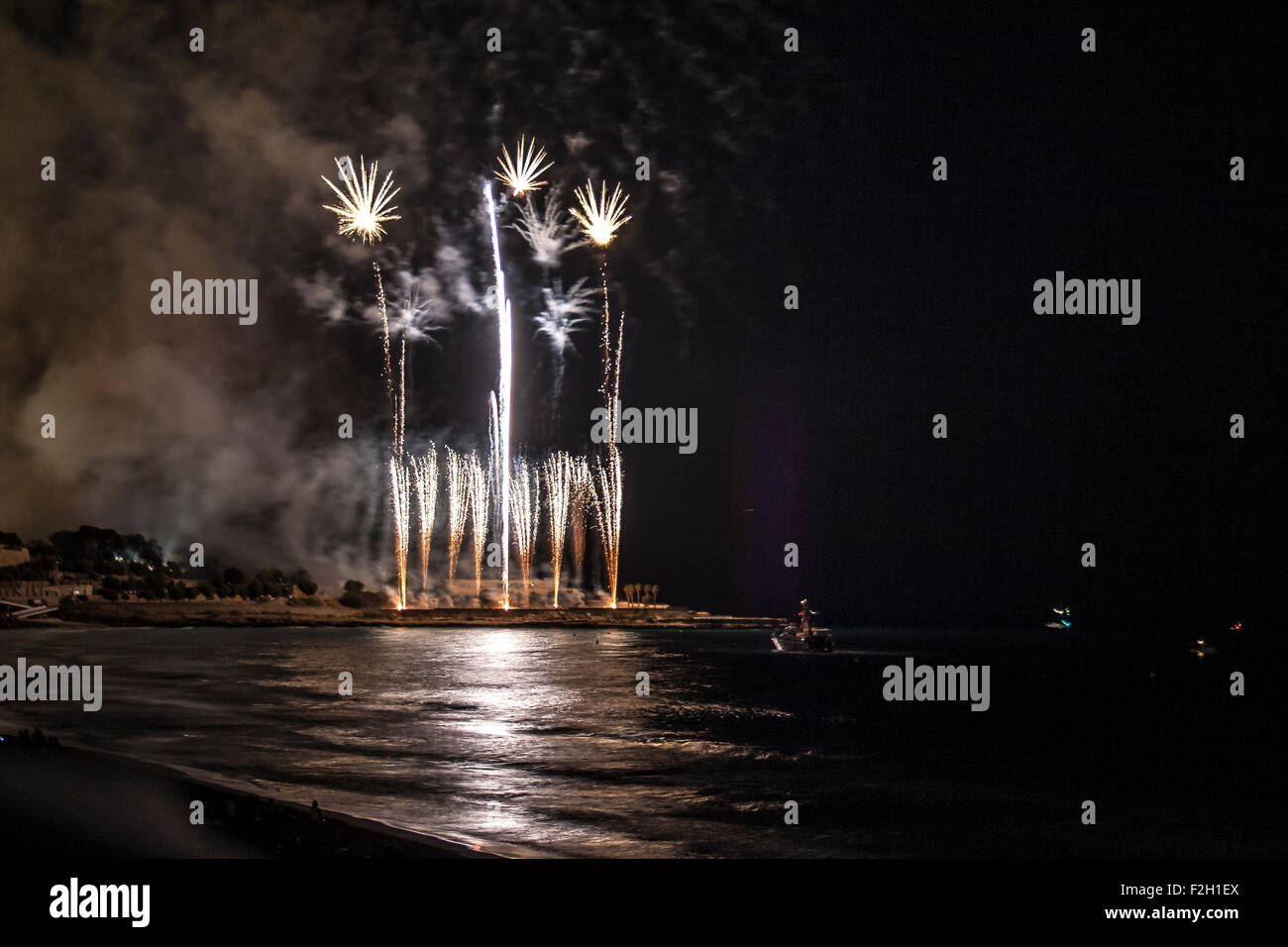 Fireworks over sea and Reflecting in Water Stock Photo - Alamy