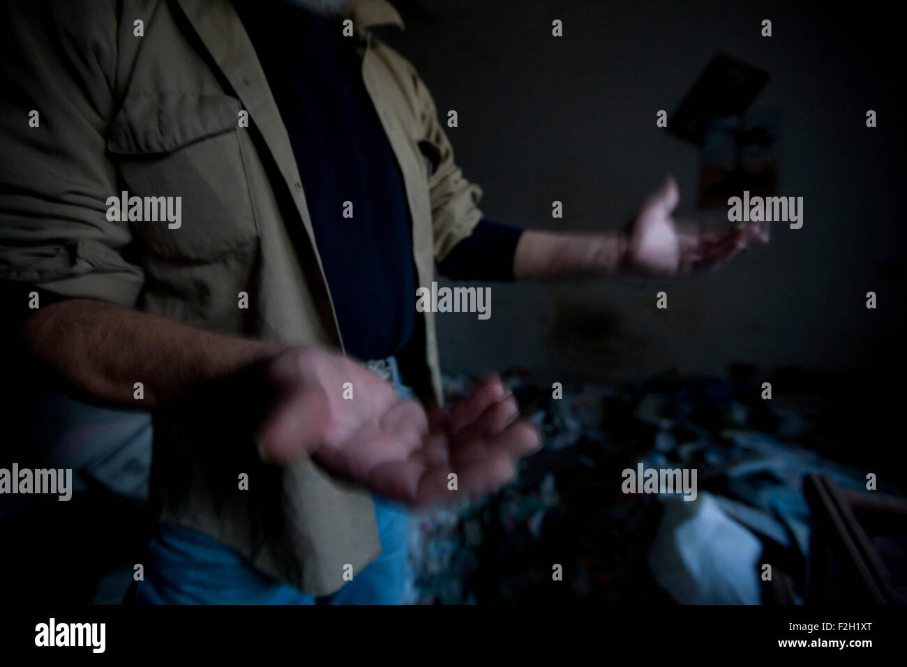 Poor man with open hands signifiying his desparation and need of help ...