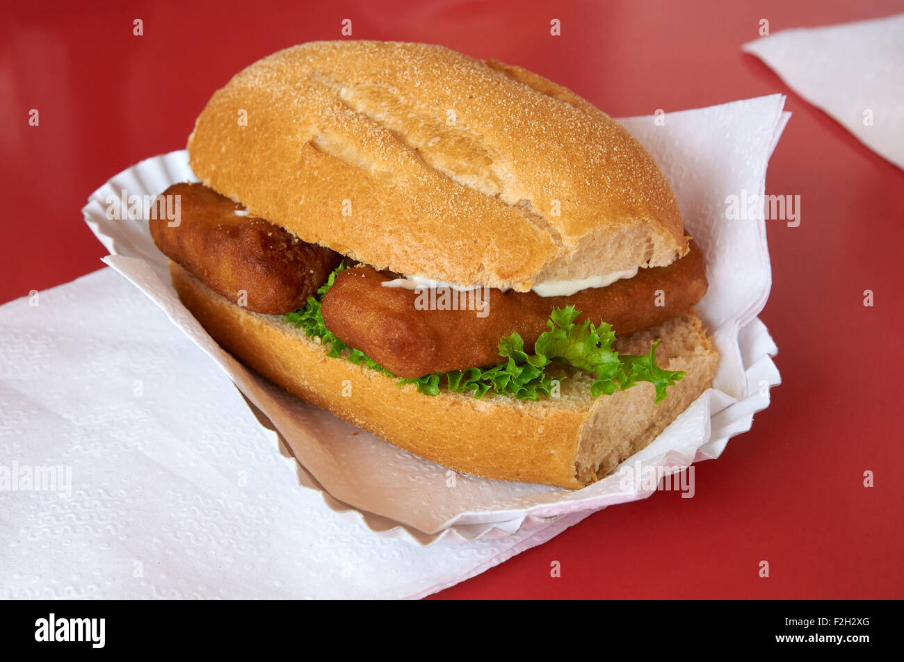 Bun with fish and mayonnaise, street food Stock Photo - Alamy