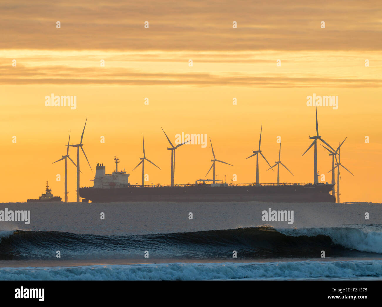 Ship passing Teesside Offshore Wind farm on the north east coast of ...