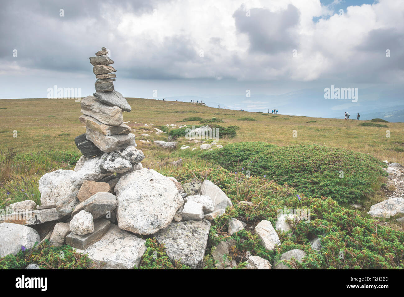 Stacked stones in the mountain. Dramatic sky Stock Photo - Alamy