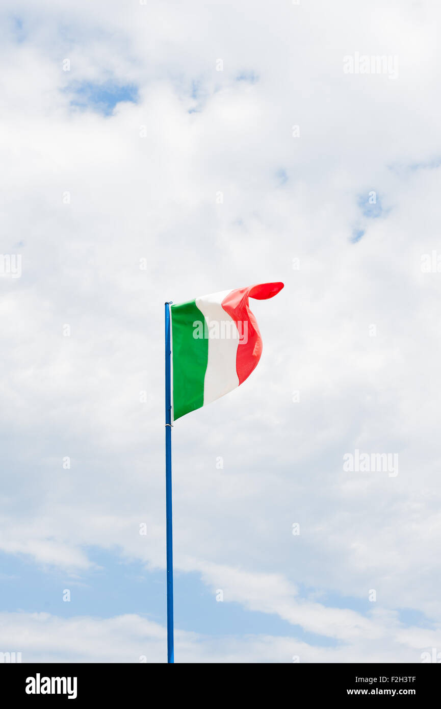Italian flag in cloudy sky vertical and copy space Stock Photo - Alamy