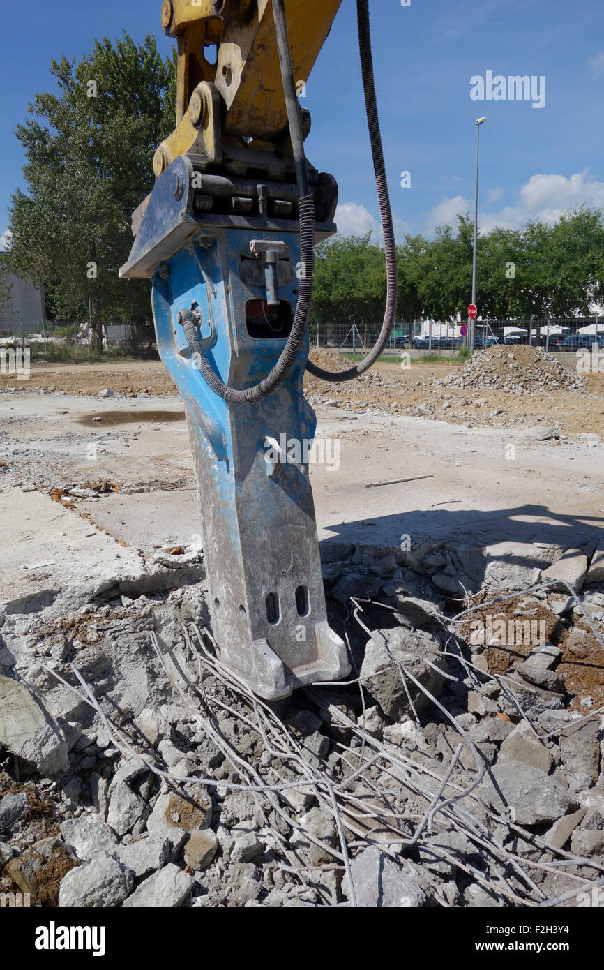 Big excavator with hammer, for concrete demolition Stock Photo - Alamy