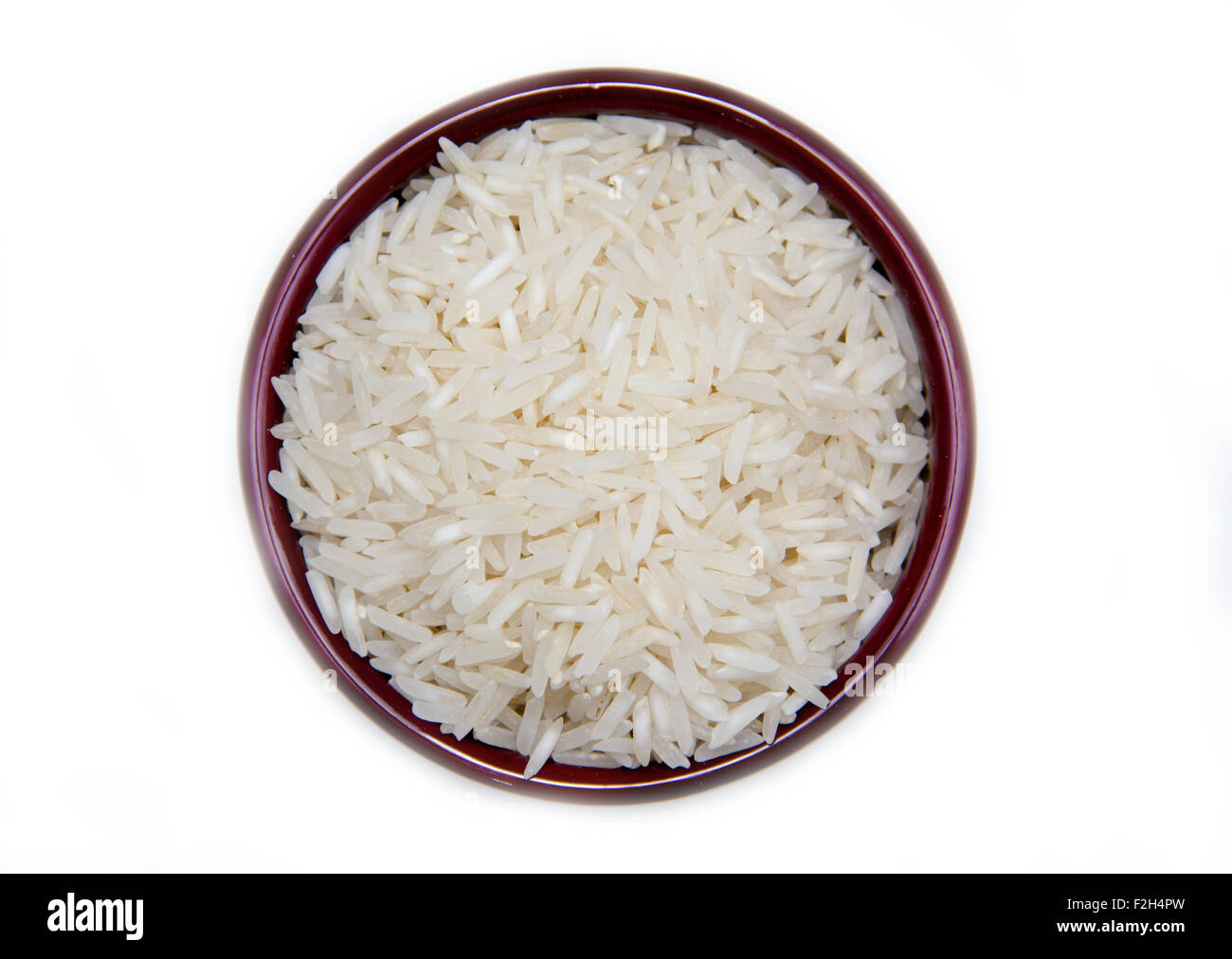Bowl with uncooked rice on a white background seen from above Stock ...