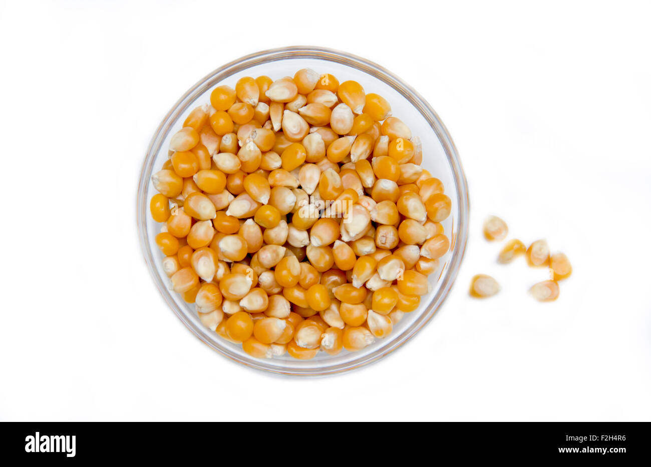 Bowl of dried corn kernels on a white background seen from above Stock ...