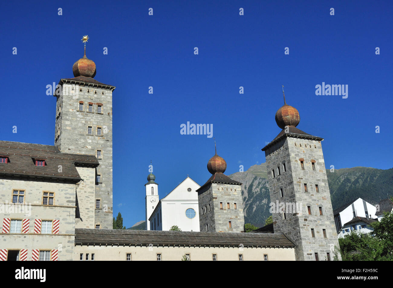 The towers of Stockalper Castle and the church behind, Brig, Valais ...