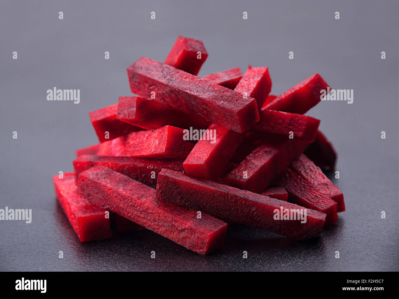 Beetroot slice striped closeup on dark background Stock Photo - Alamy