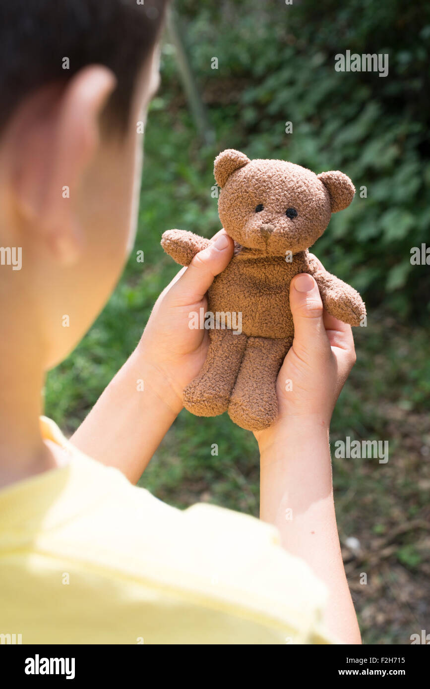 Baby holding hands teddy bear hi-res stock photography and images - Alamy