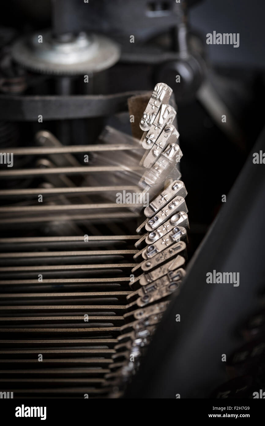 Detail view of typebars in a typewriter with one bar moving Stock Photo ...