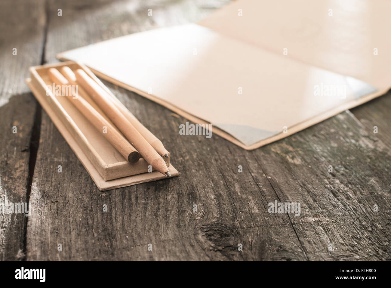 Vintage pencil and drawing paper. Weak sunlight Stock Photo - Alamy