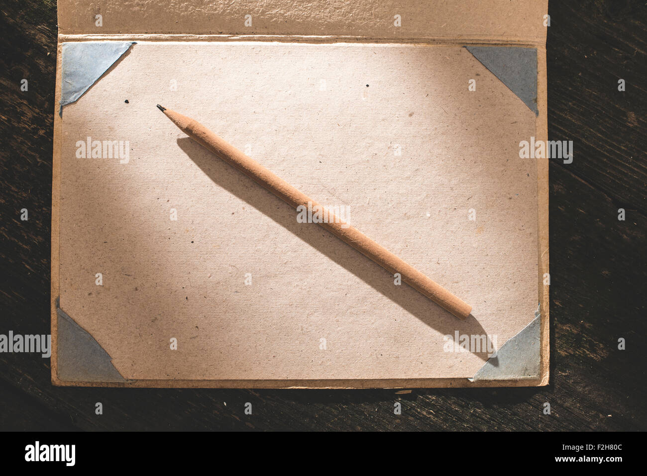 Vintage pencil and drawing paper. Weak sunlight Stock Photo - Alamy