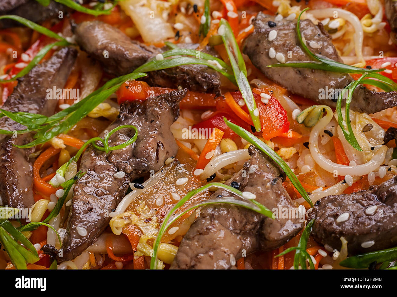 Fried chicken liver with rice and vegetable Stock Photo - Alamy