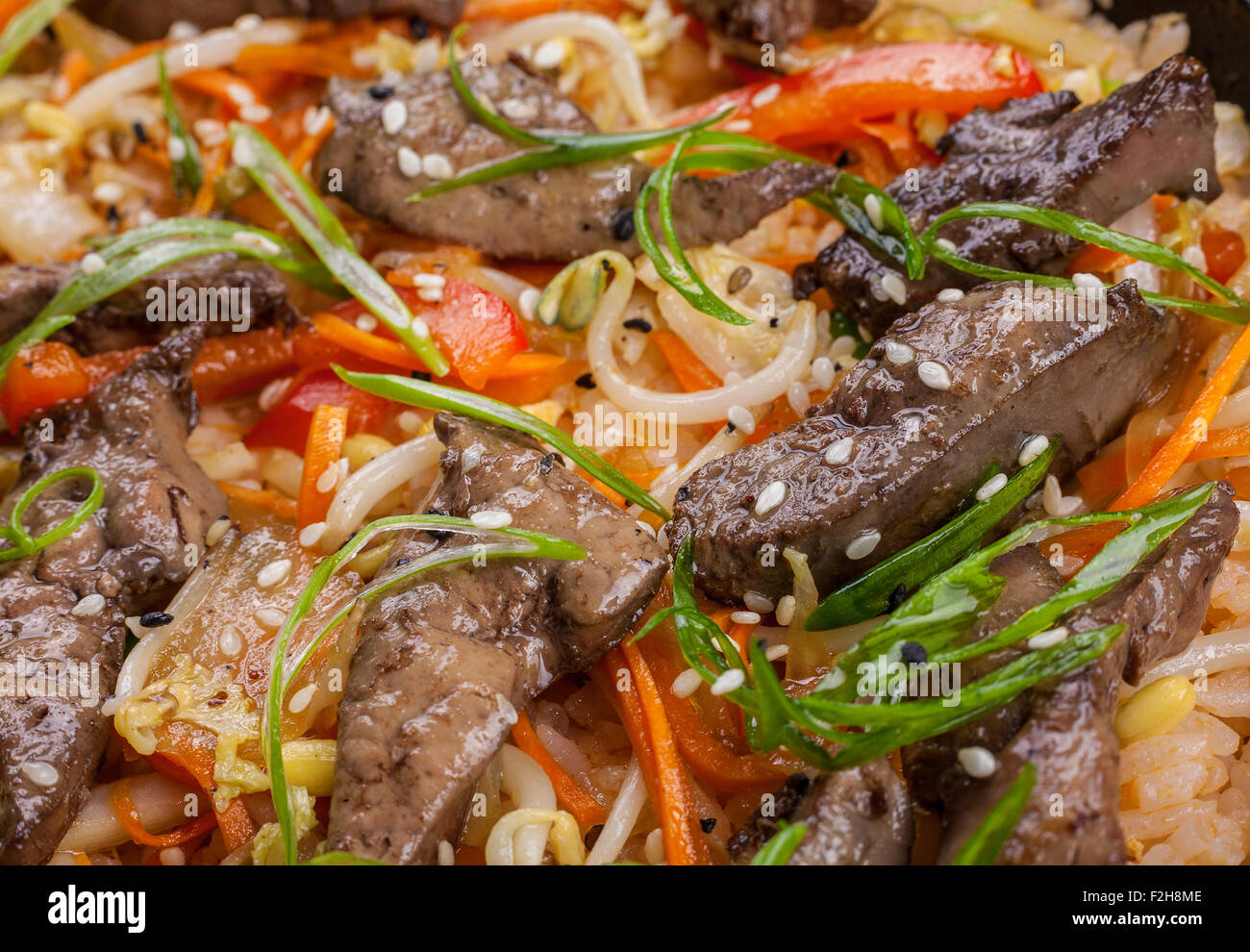 Fried chicken liver with rice and vegetable Stock Photo - Alamy