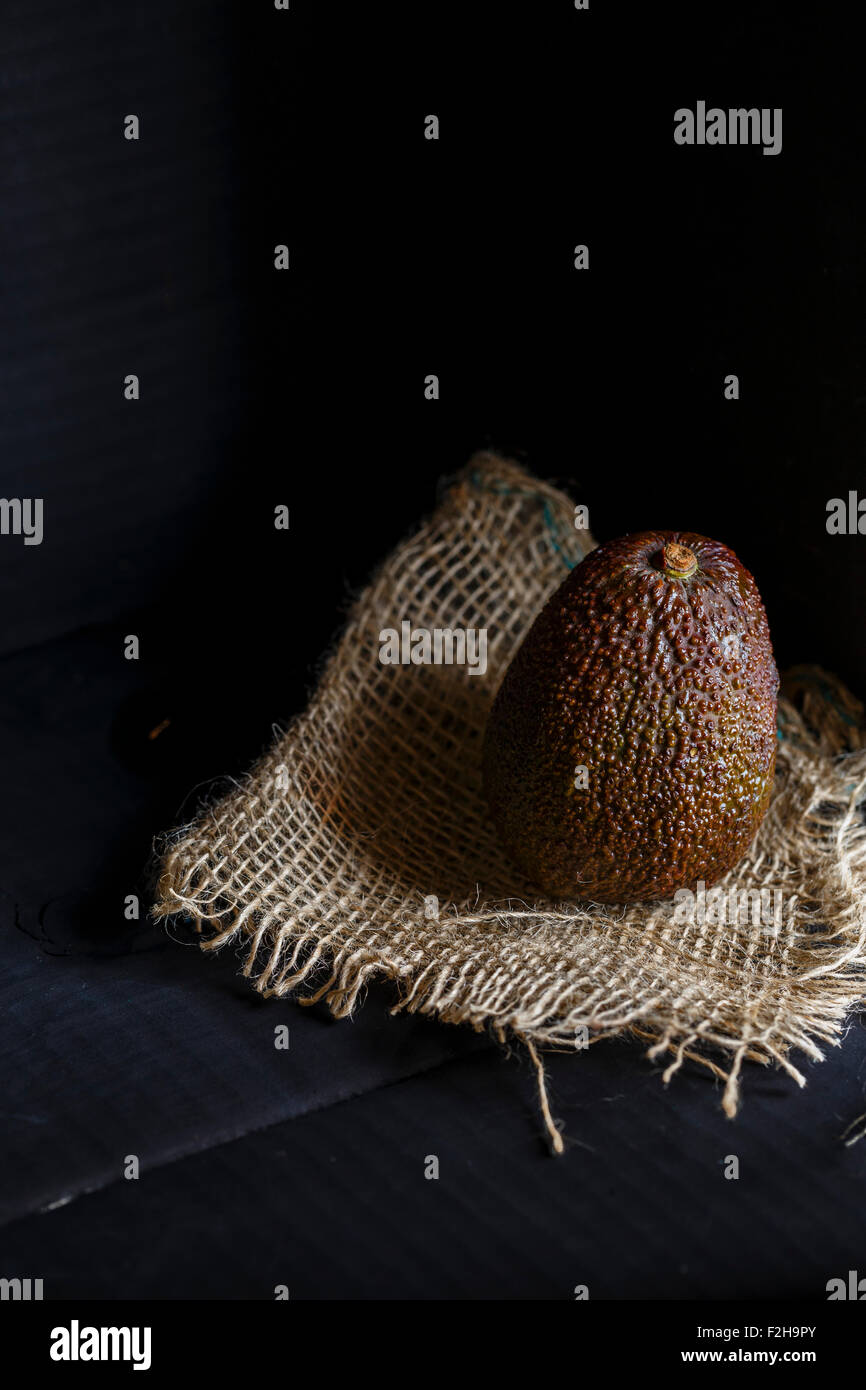 Avocado on a woven mat Stock Photo - Alamy