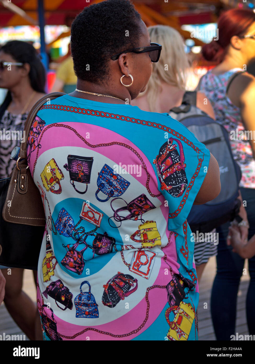 Colorful clothes being worn by visitors to Brighton Pier Stock Photo ...