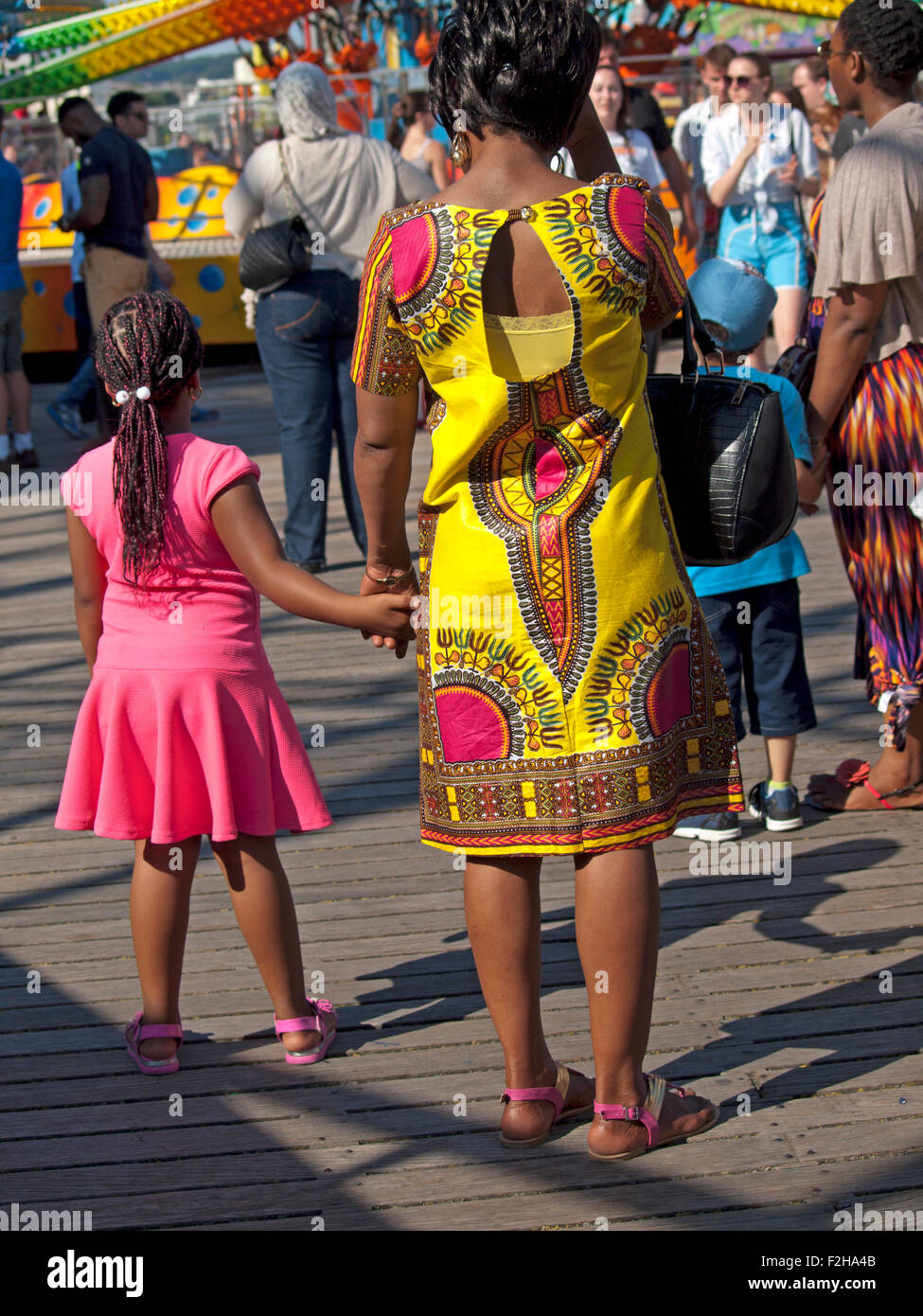 Colorful clothes being worn by visitors to Brighton Stock Photo - Alamy