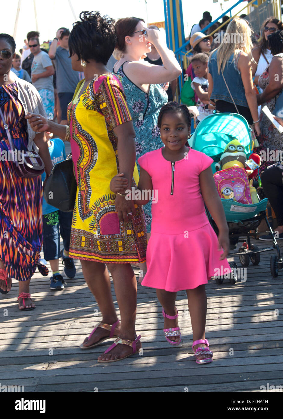 Colorful clothes being worn by visitors to Brighton Stock Photo - Alamy