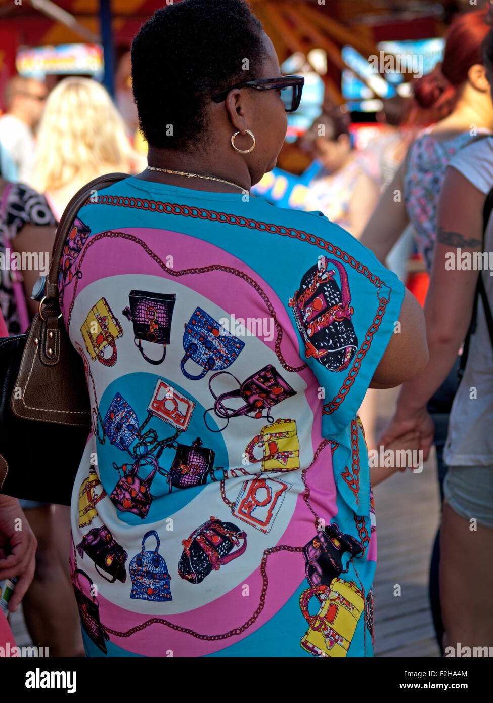 Colorful clothes being worn by visitors to Brighton Stock Photo - Alamy
