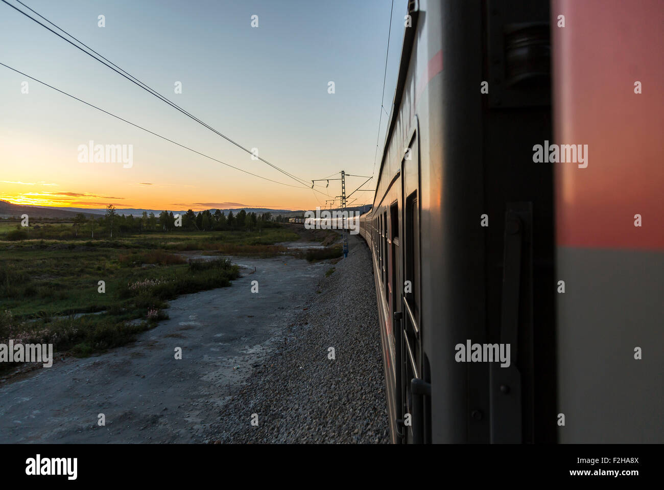 Sunset on a Train Stock Photo - Alamy