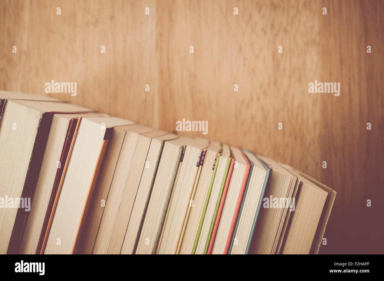 books and manuals lined up side view - natural wood background Stock ...