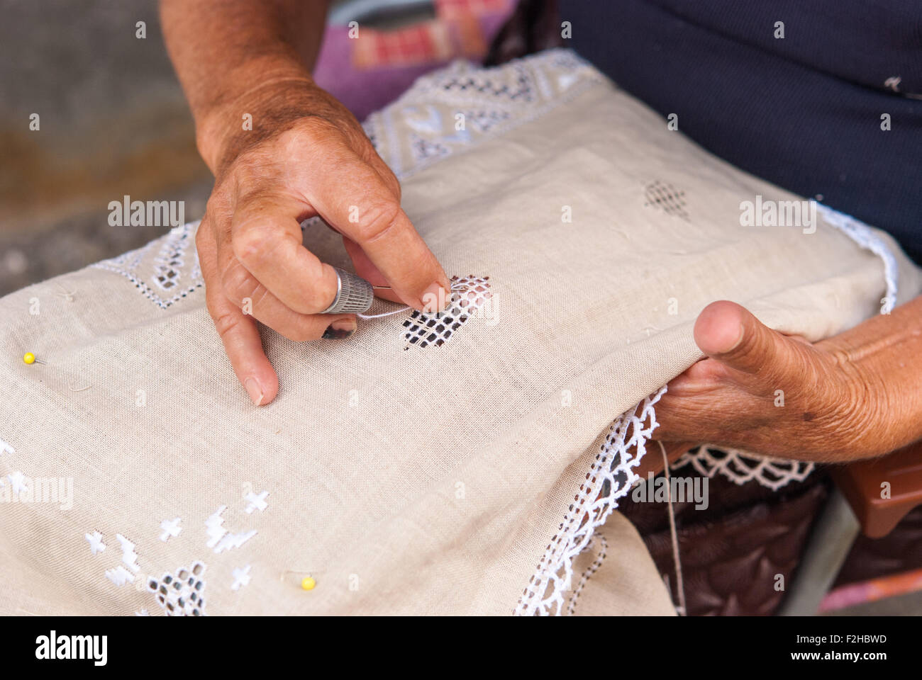 Old woman embroidering hi-res stock photography and images - Alamy