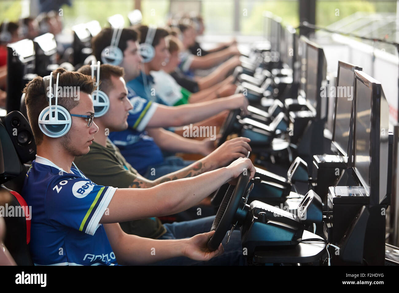 Participants of the ADAC Sim Racing Trophy in front of the simulator ...