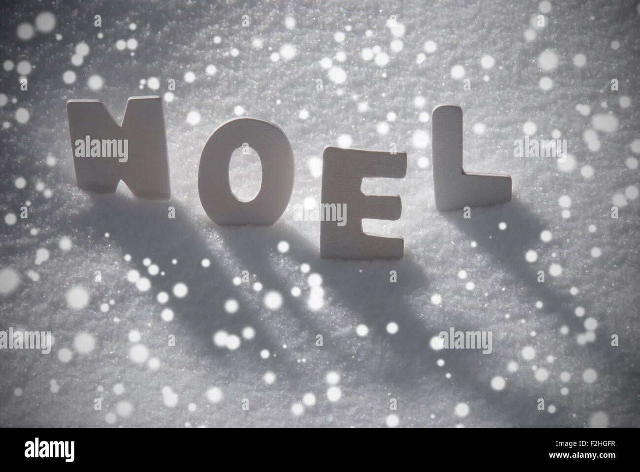 White Word Noel Means Christmas On Snow, Snowflakes Stock Photo - Alamy