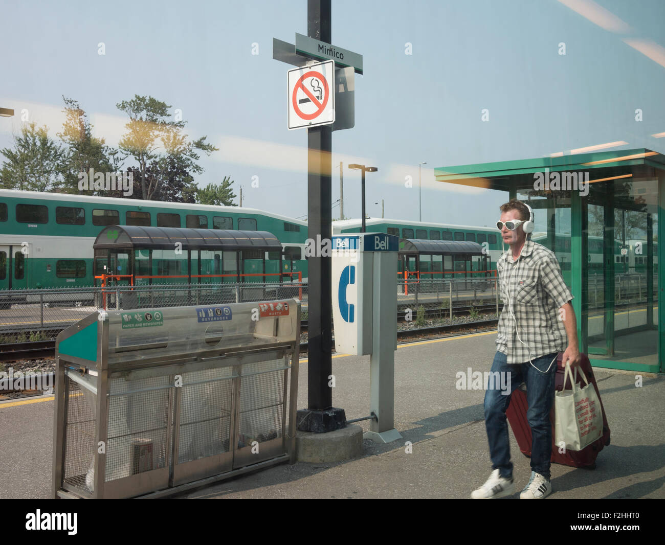 GO Transit, Toronto. Passenger getting off the train and walking Stock ...