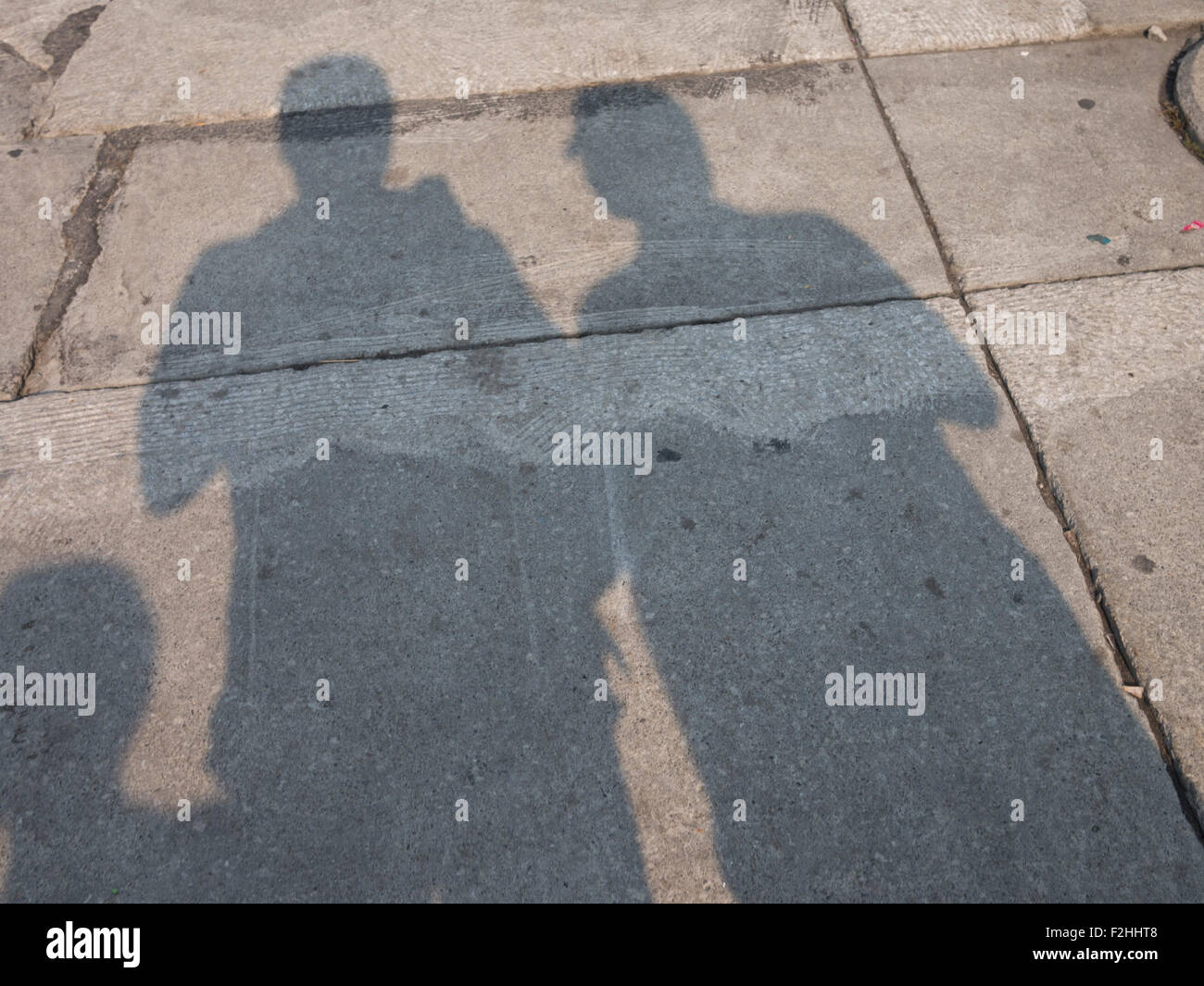 Shadow of people in sidewalk Stock Photo - Alamy