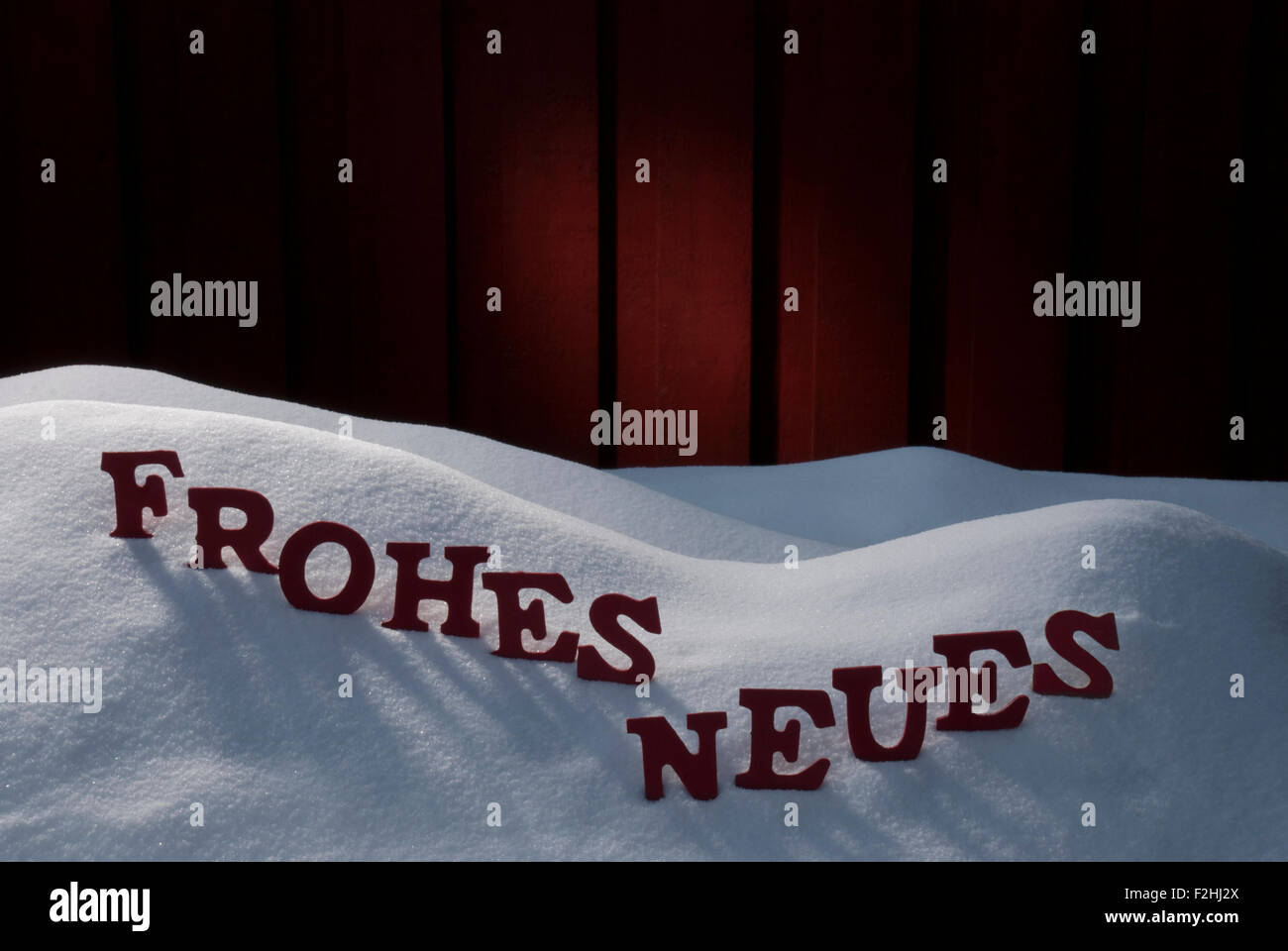 Frohes Neues Means Happy New Year On Snow Stock Photo - Alamy