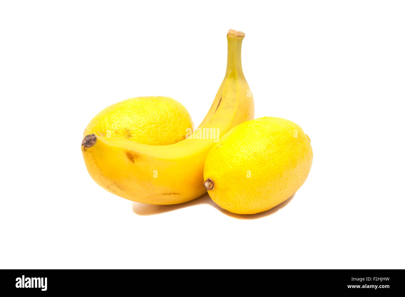Banana And Two Lemon isolated Stock Photo - Alamy