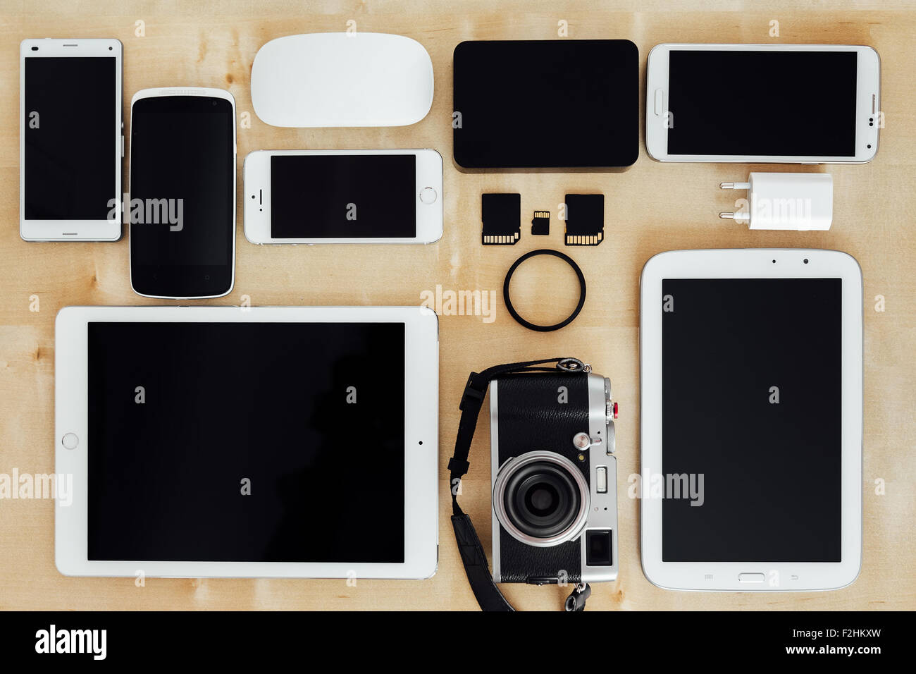 Collection of digital tools of a photographer, with camera, cards, and ...