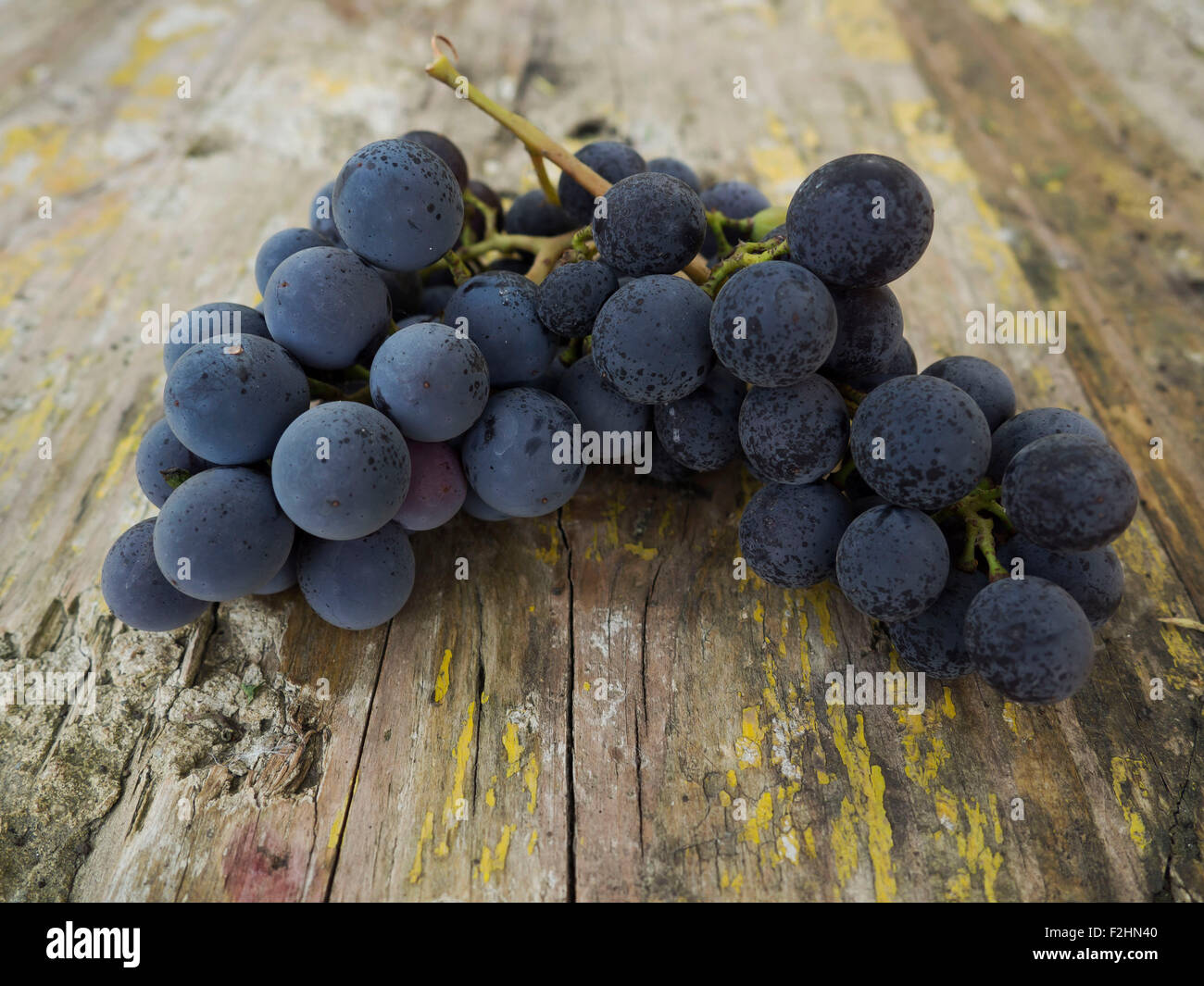 Grape on rustic table Stock Photo - Alamy