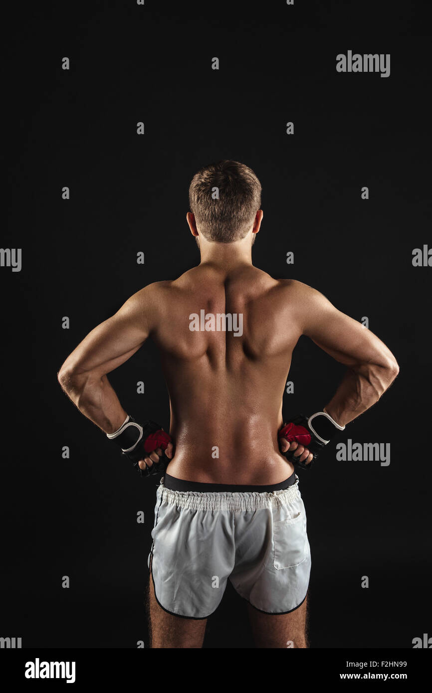 Athletic bearded boxer with gloves on a dark background Stock Photo - Alamy