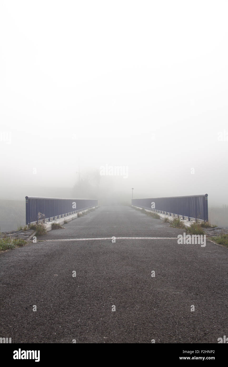 Bridge rails disappearing into fog Stock Photo - Alamy