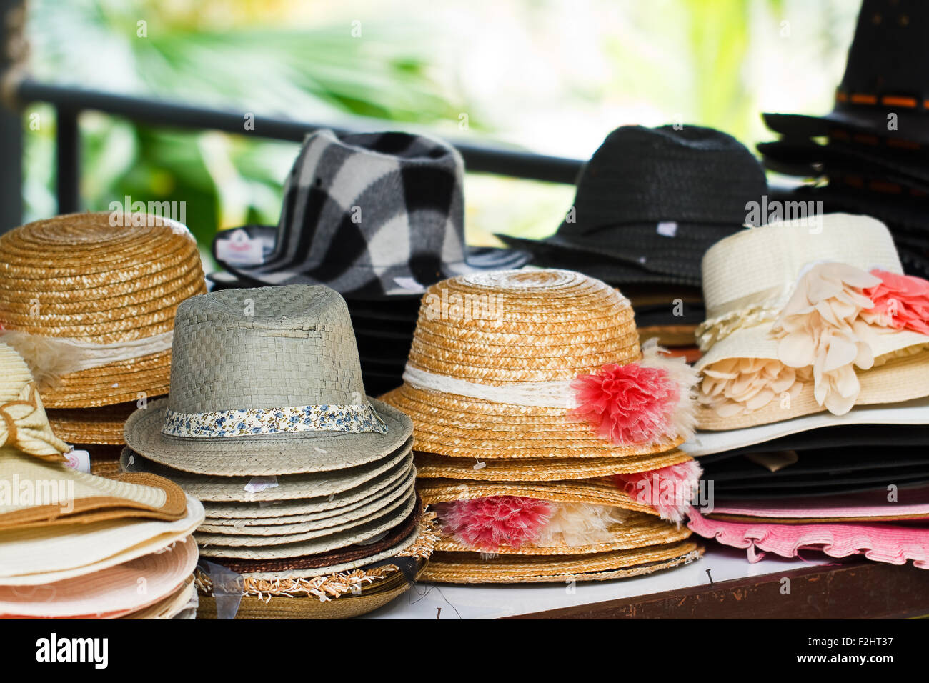 Pretty straw hat with flower Stock Photo - Alamy