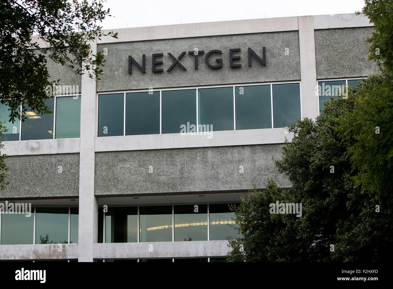 A logo sign outside of a facility occupied by NextGen Healthcare in ...