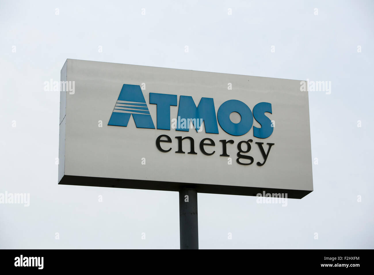 A logo sign outside of a facility occupied by Atmos Energy in Round ...