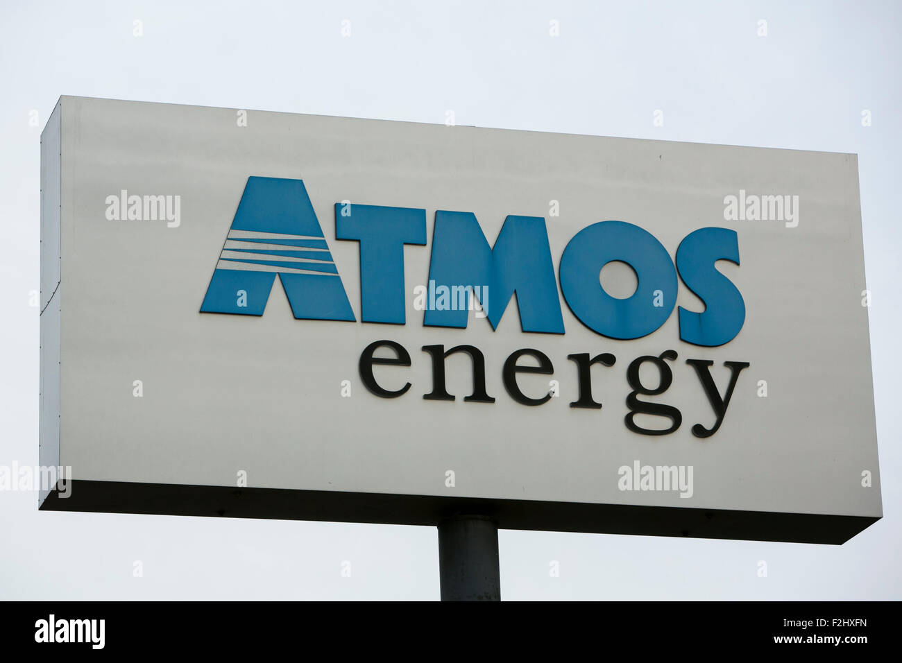 A logo sign outside of a facility occupied by Atmos Energy in Round ...