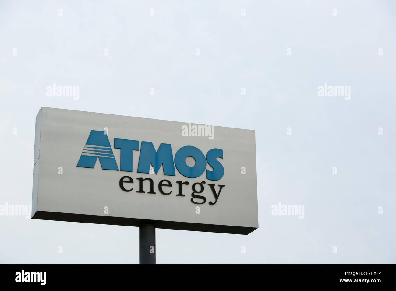 A logo sign outside of a facility occupied by Atmos Energy in Round ...