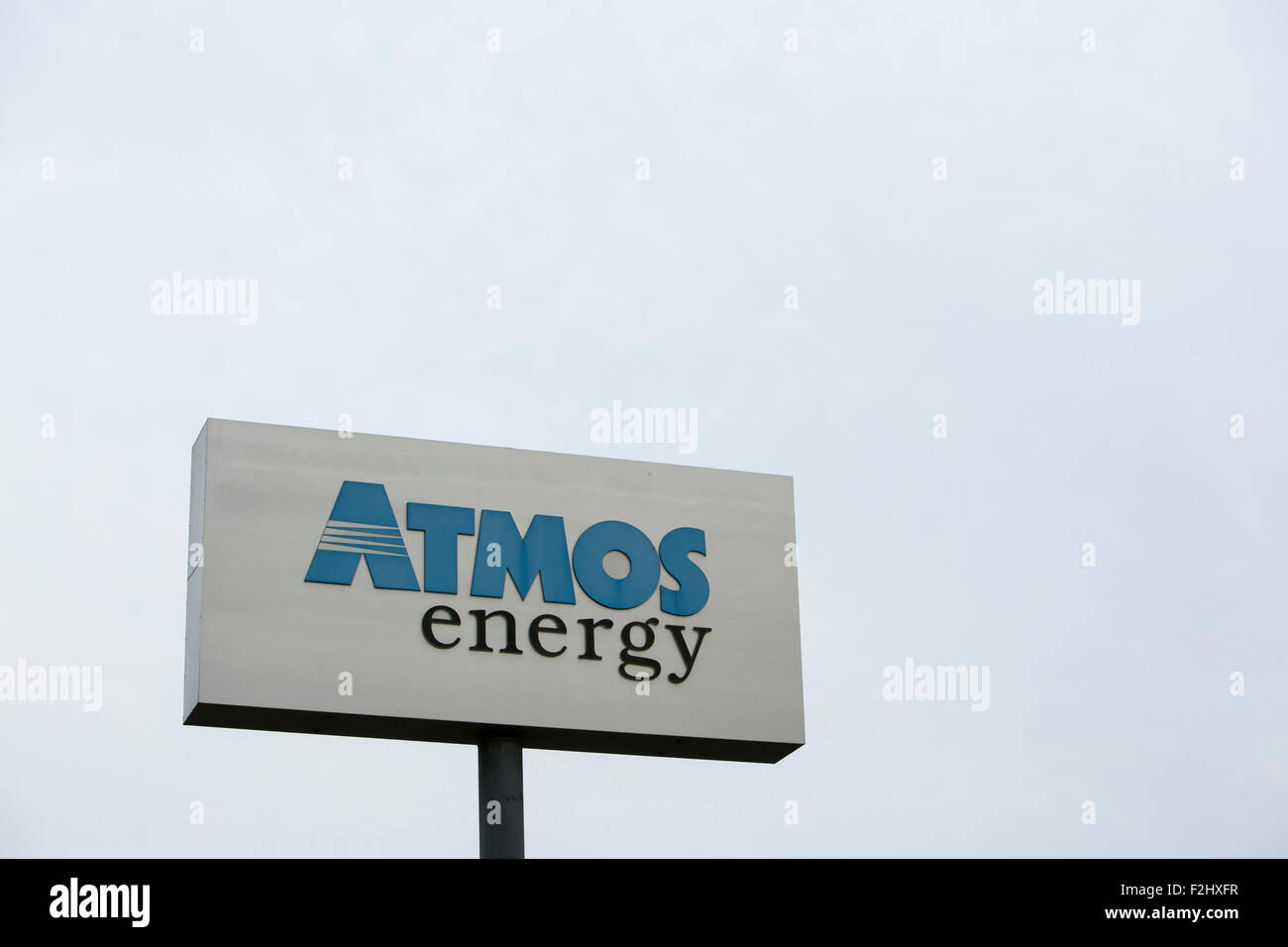 A logo sign outside of a facility occupied by Atmos Energy in Round ...