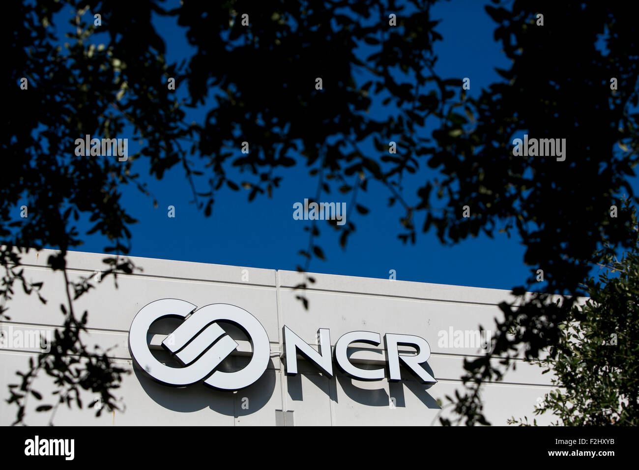 A logo sign outside of a facility occupied by the NCR Corporation in ...