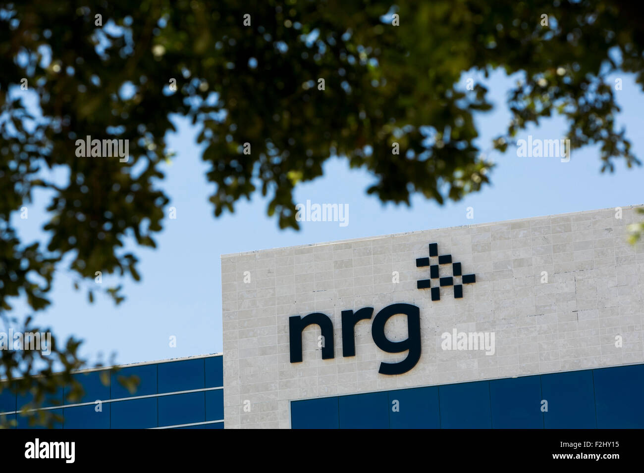 A logo sign outside of a facility occupied by NRG Energy, Inc., in ...