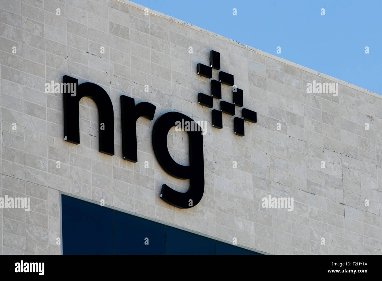 A logo sign outside of a facility occupied by NRG Energy, Inc., in ...