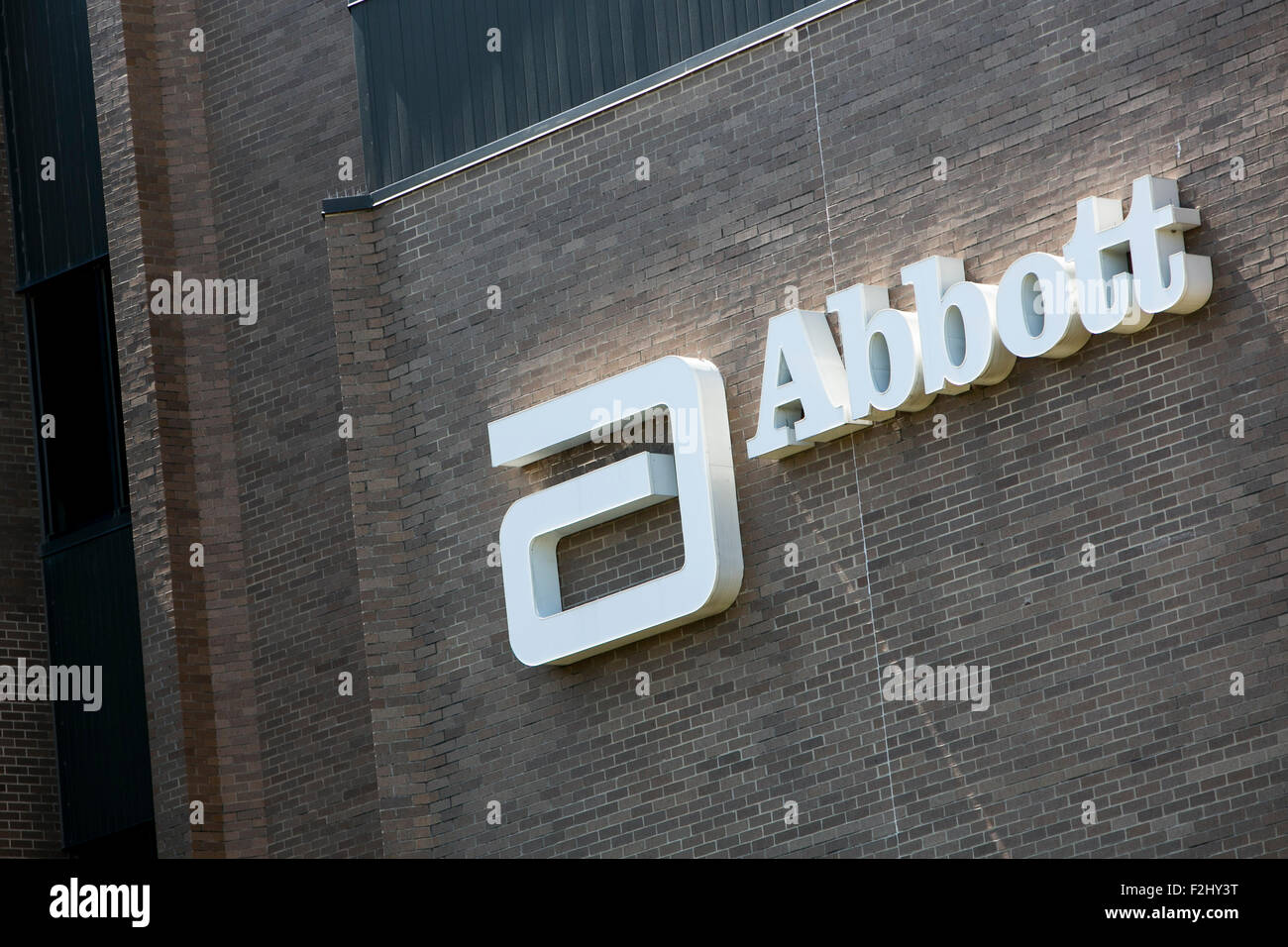A logo sign outside of a facility occupied by Abbott Diagnostics in ...