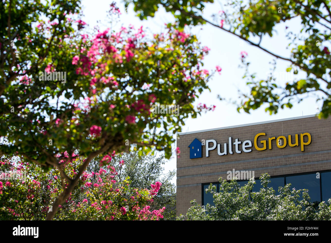 A logo sign outside of a facility occupied by the Pulte Group in Irving ...